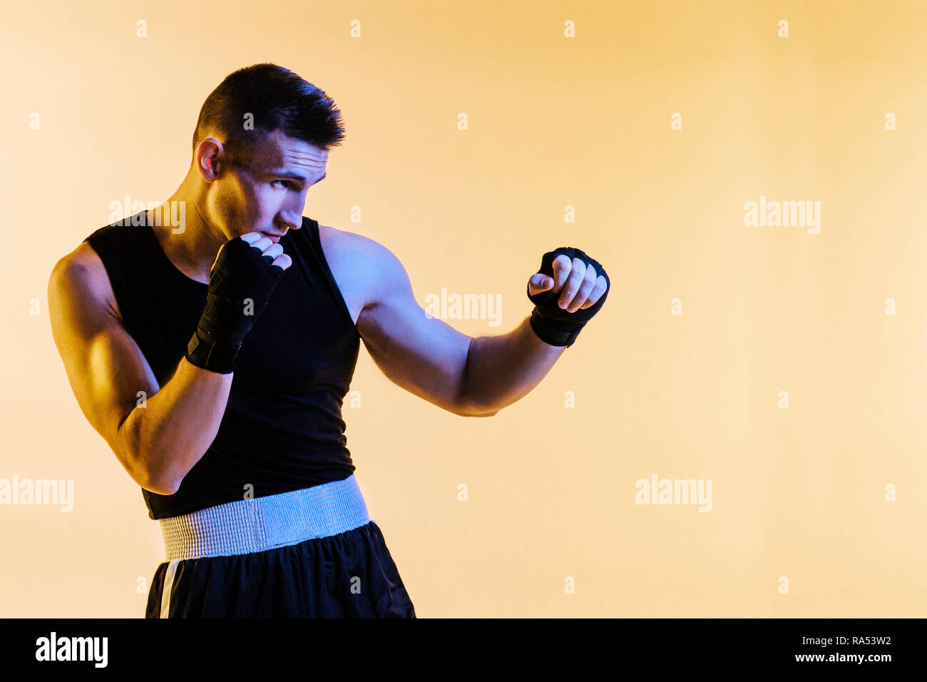 portrait of boxer in attack position Stock Photo - Alamy
