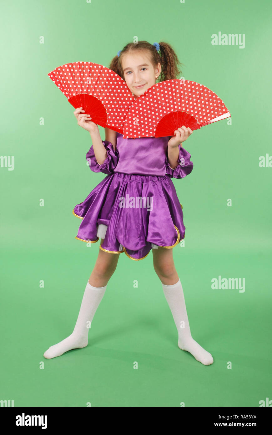 Pretty Girl Posing For The Camera In A Violet Short Dress Isolated On