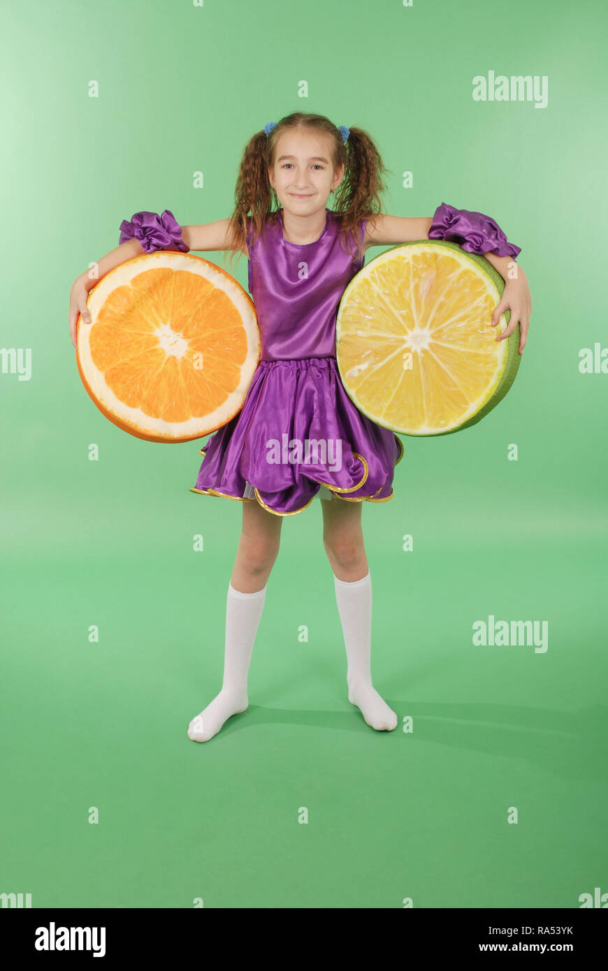 Pretty Girl Posing For The Camera In A Violet Short Dress Isolated On