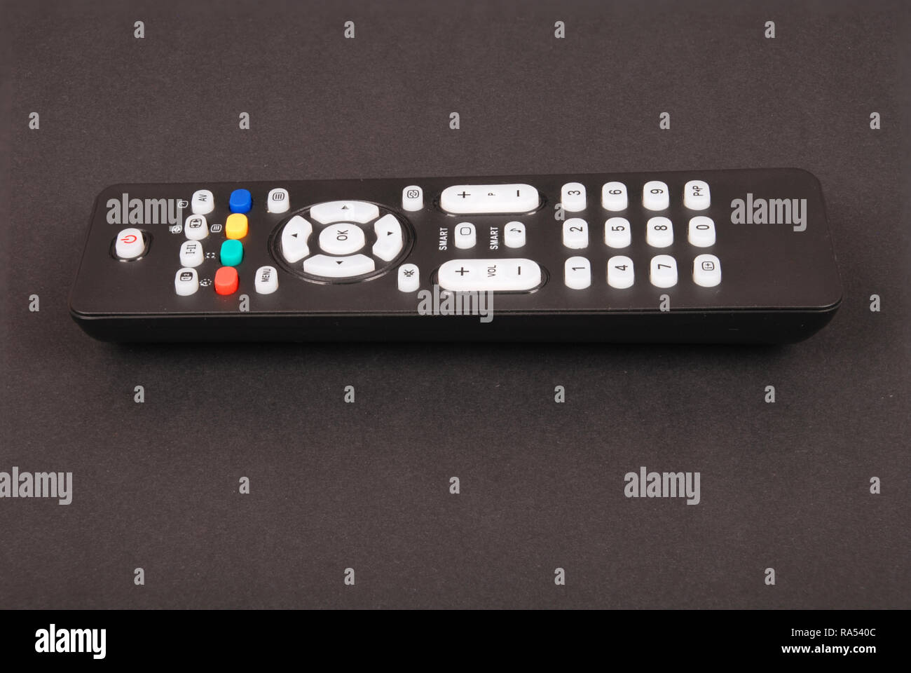 Black remote control for TV isolated on black background Stock Photo ...