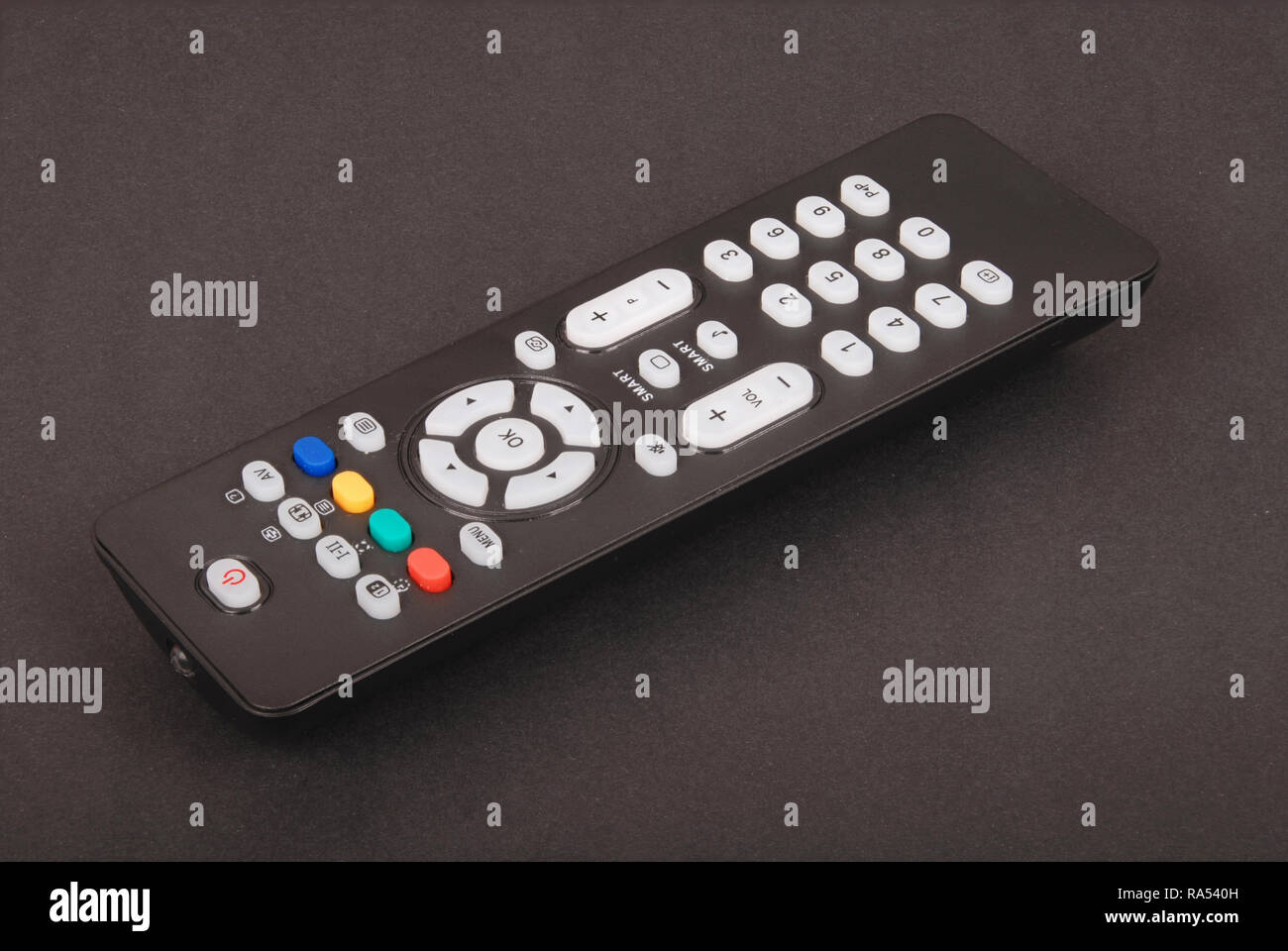 Black remote control for TV isolated on black background Stock Photo ...