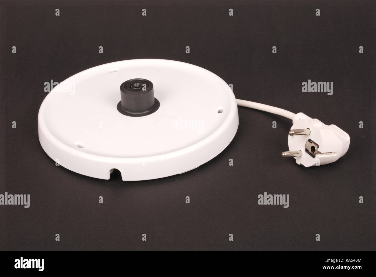 Base unit for electrical kettle isolated on the black background Stock ...