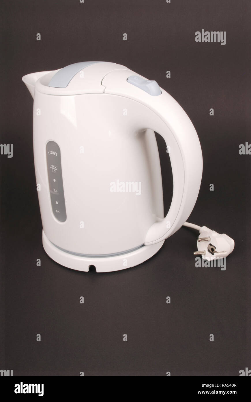 White electric kettle isolated on black background Stock Photo - Alamy