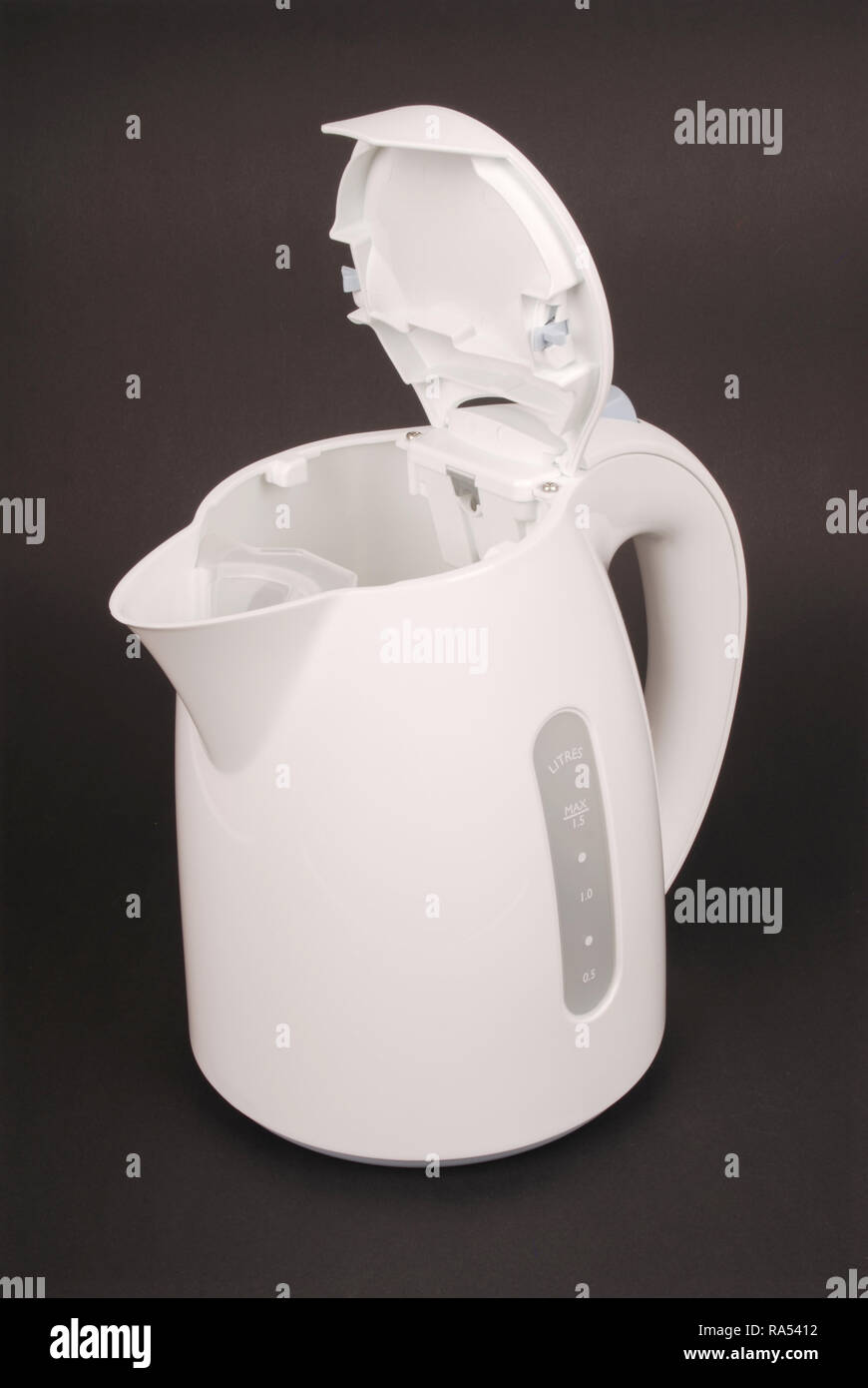 White electric kettle isolated on black background Stock Photo - Alamy