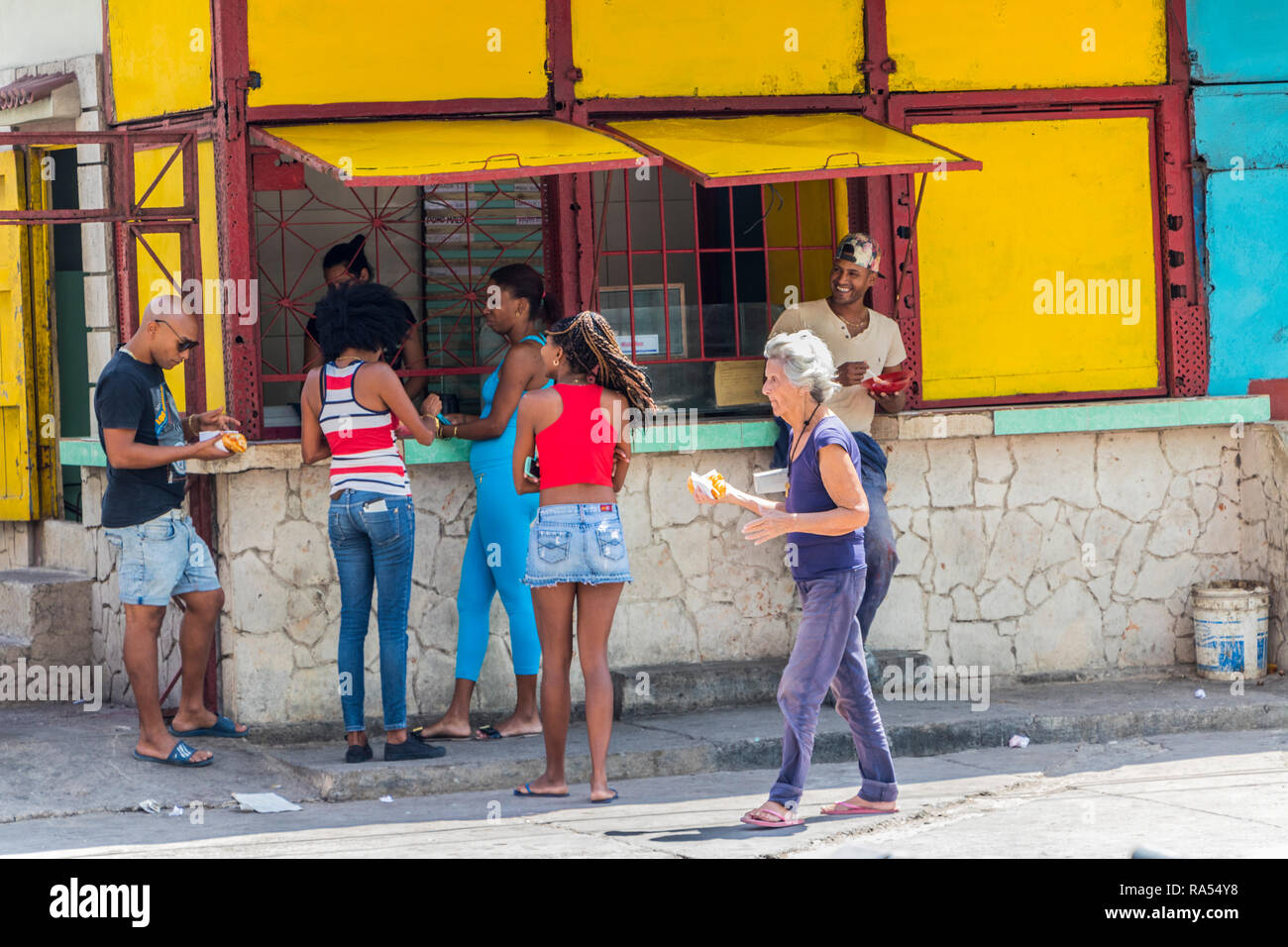 Cuban people line up at restaurant bar store in Havana cuba Stock Photo ...