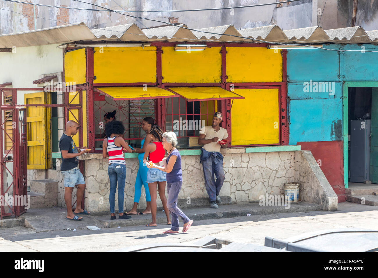 Cuban people line up at restaurant bar store in Havana cuba Stock Photo ...