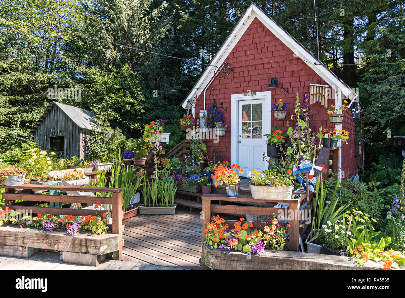 A tiny wooden house and garden along the boardwalk on Hammer Slough in ...