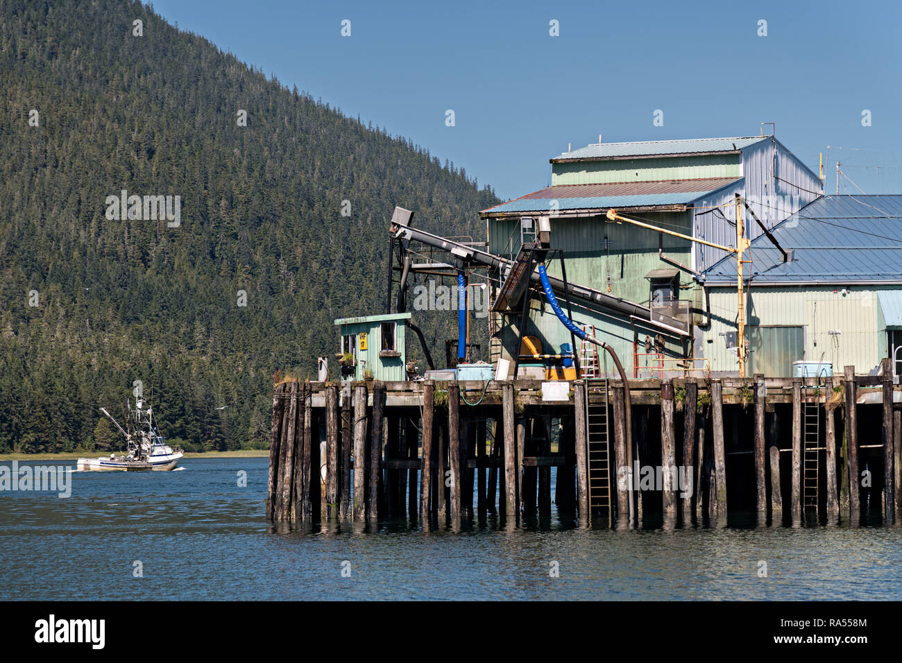 A fishing boat passes the Icicle Seafoods fish docks in the tiny ...
