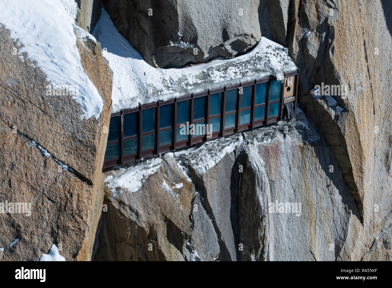 The panorama corridor partially covered by snow inset into rock face ...