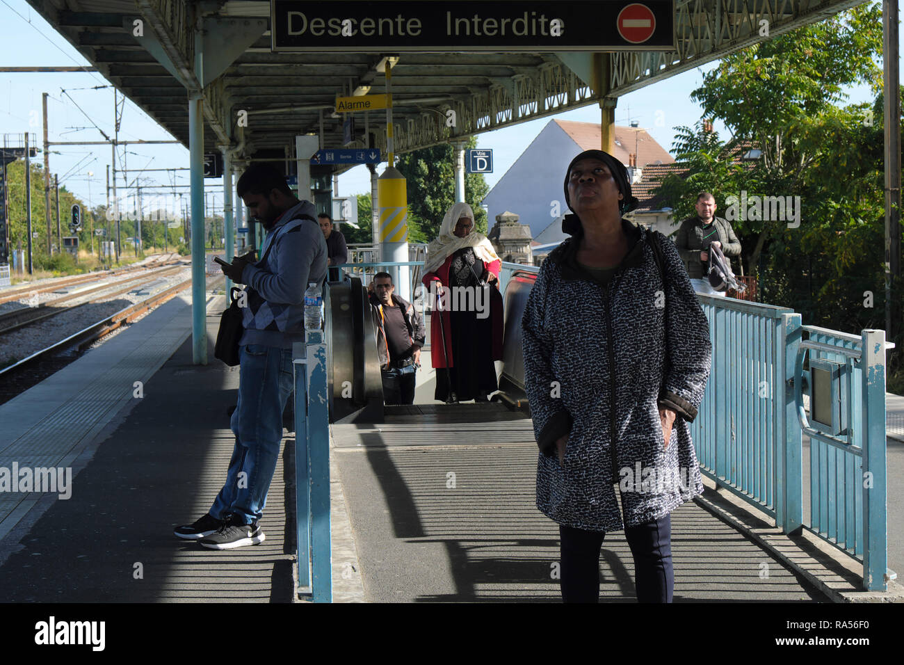 Passengers wait for a train in the train station France Stock Photo - Alamy