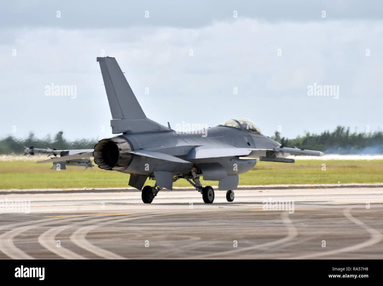 Modern fighter jet airplane taxiing for departure on a mission rear ...