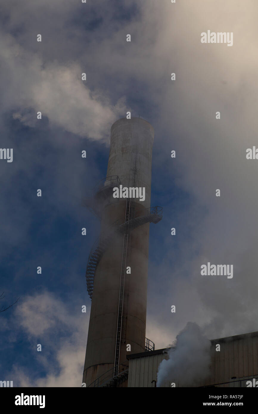 Smoke stack billowing steam Stock Photo - Alamy
