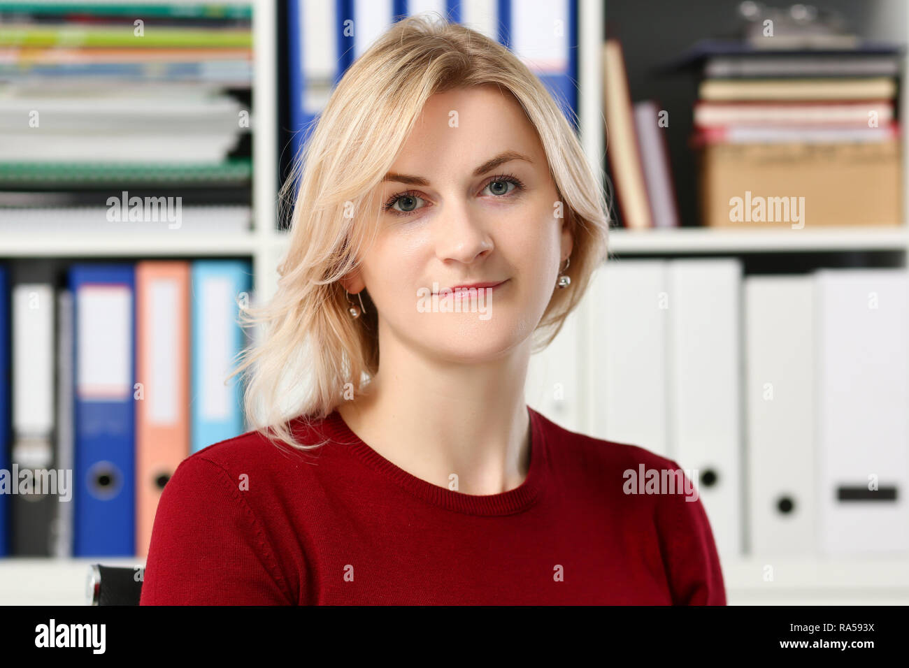 Normal blond woman portrait at office Stock Photo - Alamy