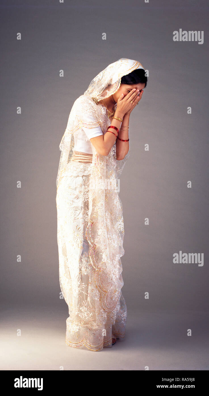 A PORTRAIT OF A PARSEE BRIDE WEARING A TRADITIONAL PARSEE GARA SAREE ...