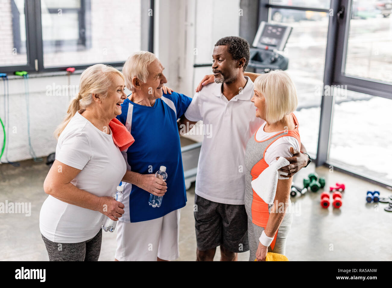Male friends talking hall hi-res stock photography and images - Alamy