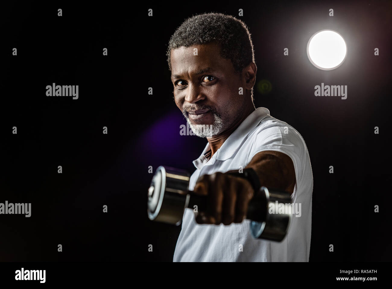 African american sportsman dumbbell exercising hi-res stock photography ...