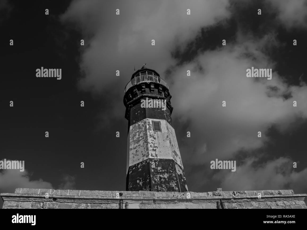 A lighthouse located in Delimara, Malta in black and white Stock Photo ...