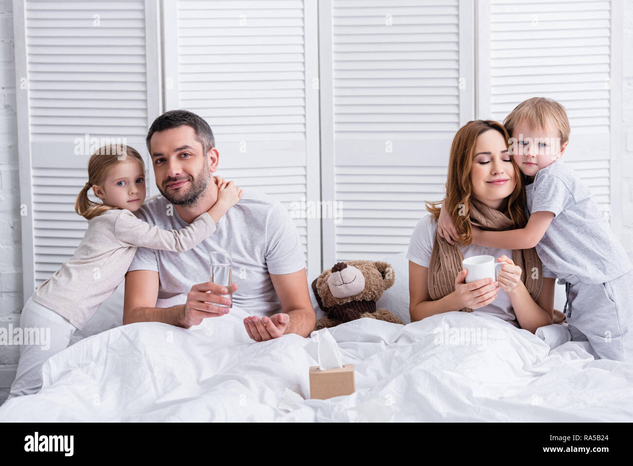 Sick mother hugging children hi-res stock photography and images - Alamy