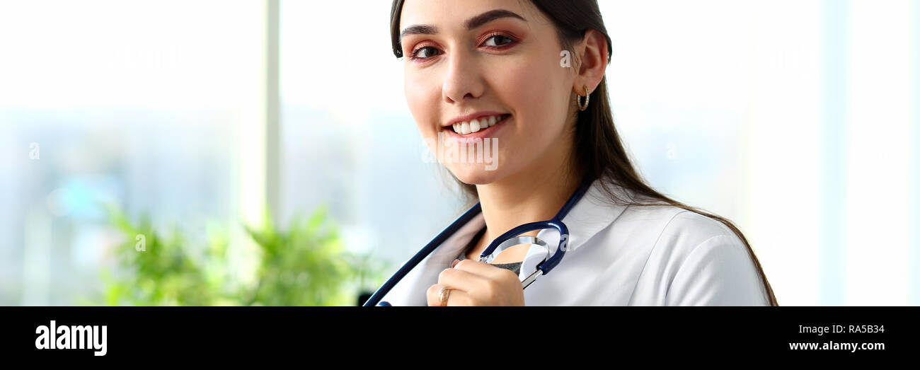 Beautiful smiling female doctor at workplace portrait Stock Photo - Alamy