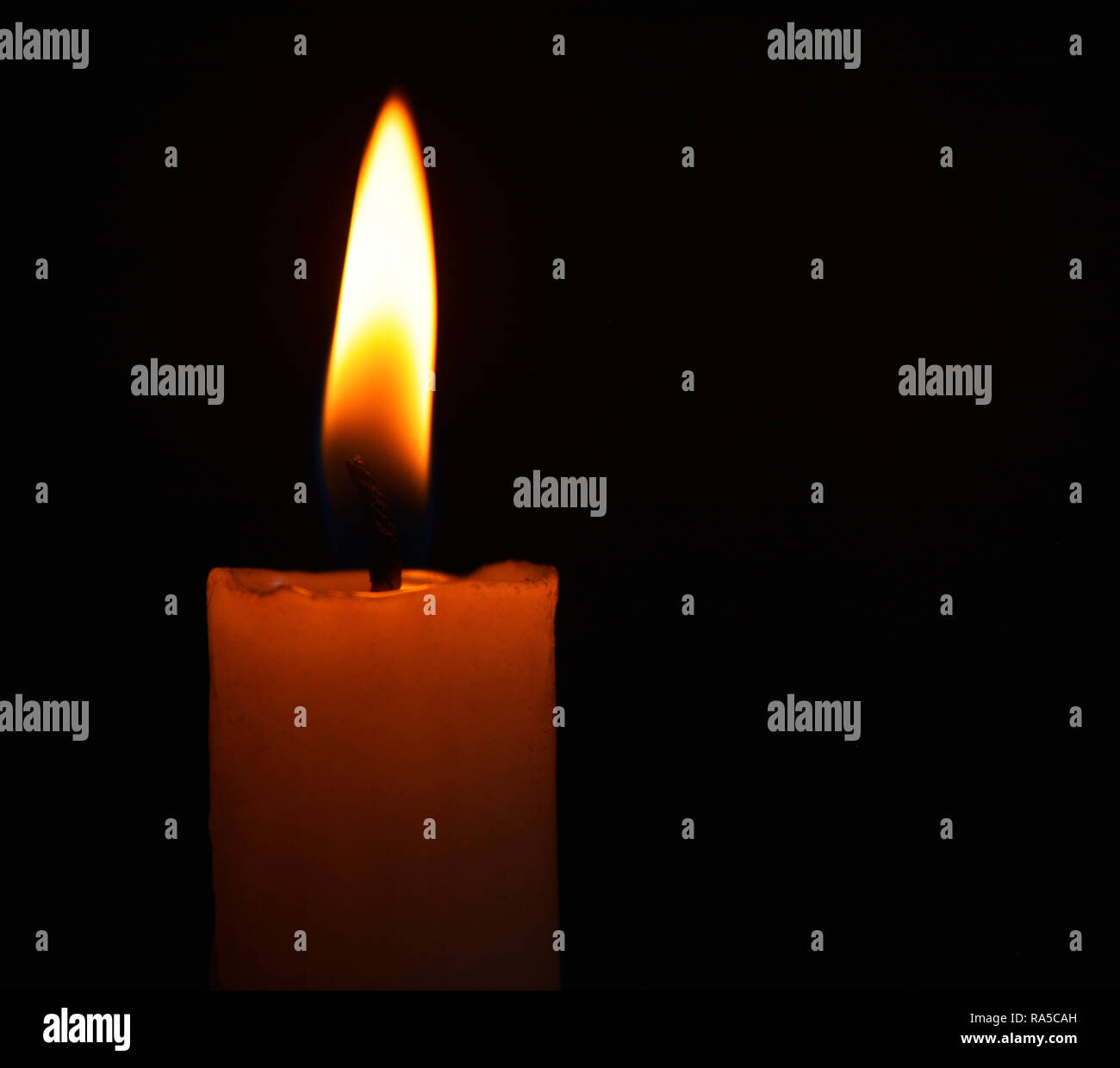 Single lit candle with quite flame Stock Photo - Alamy
