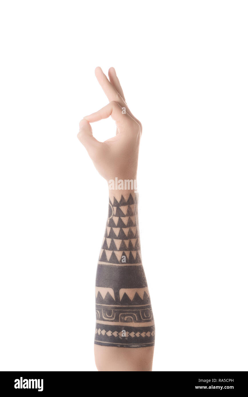 partial view of tattooed man showing ok sign isolated on white Stock ...