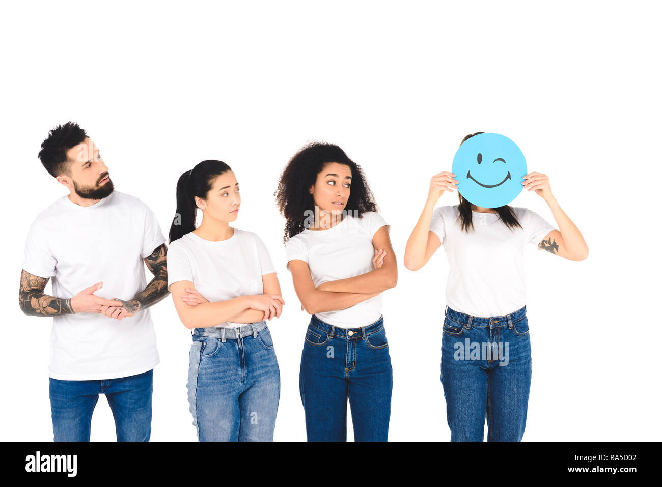 multicultural friends looking at girl with winking sign isolated on ...