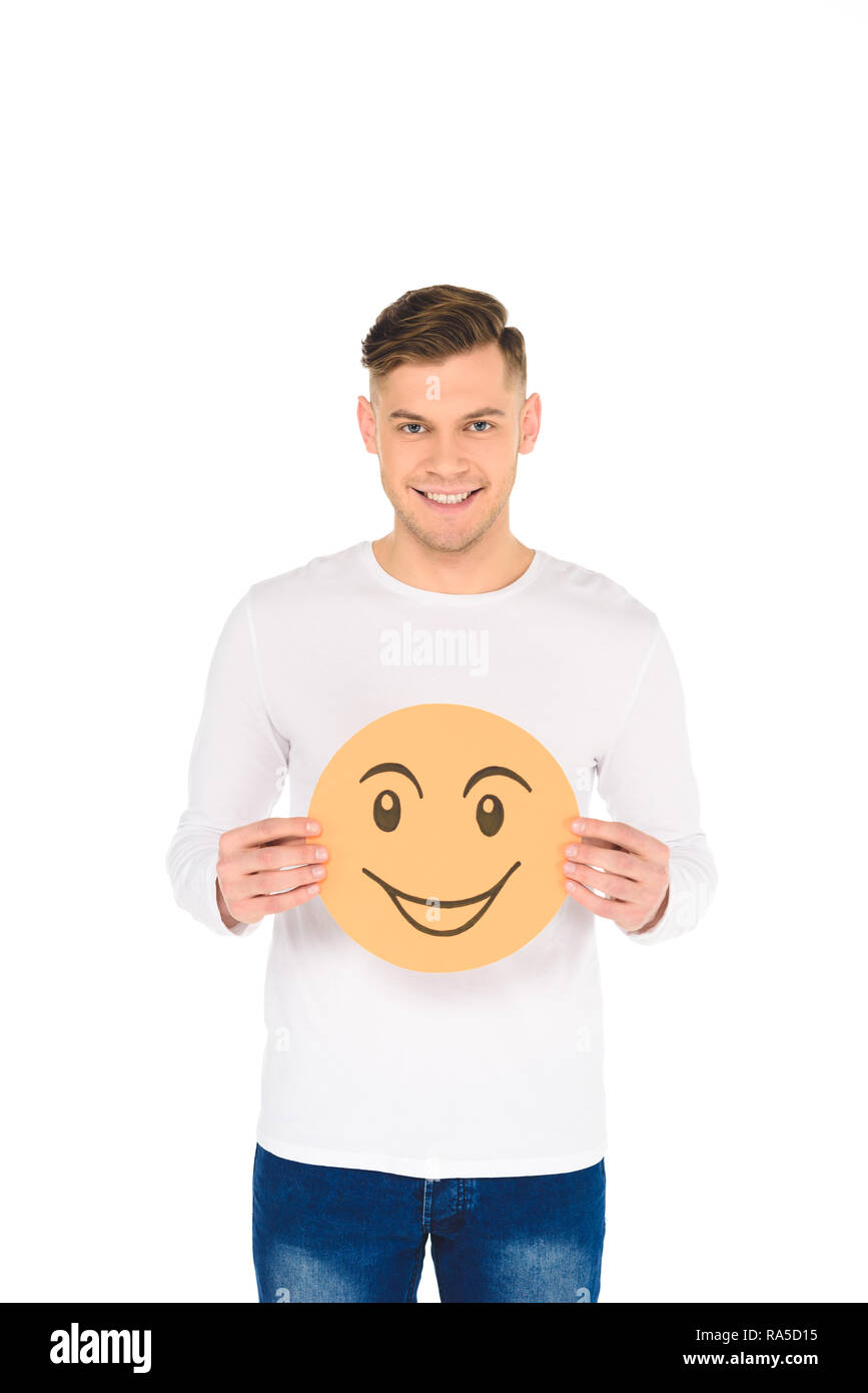 handsome man holding round yellow card with cunning face expression ...