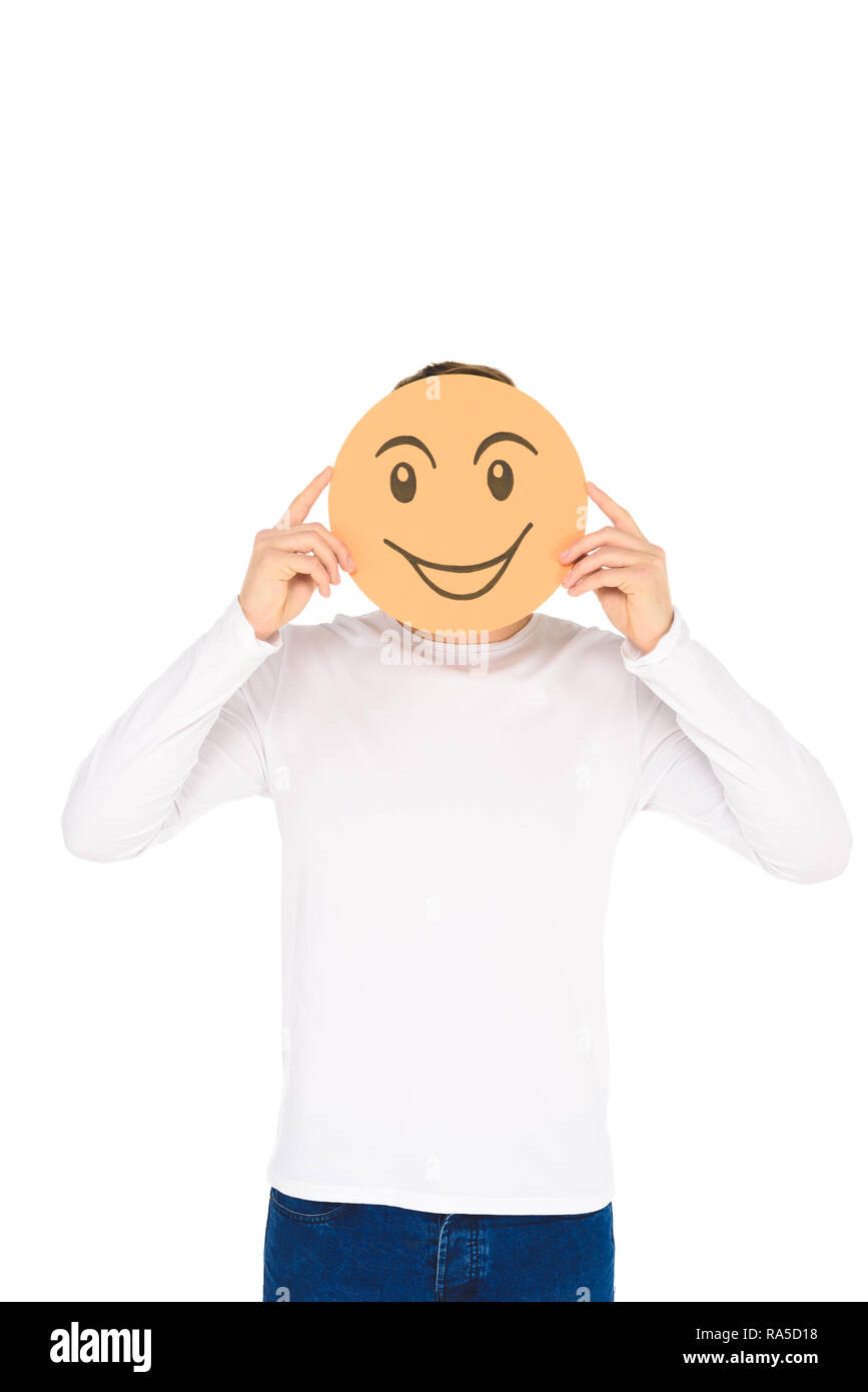 man with obscure face in white T-shirt holding yellow tricky sign ...