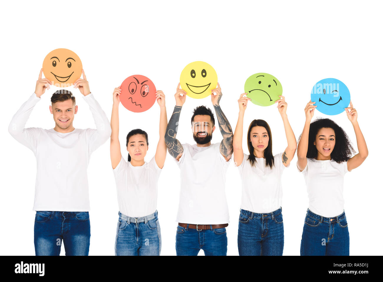 multicultural friends in denim raising cards with emotions above head ...