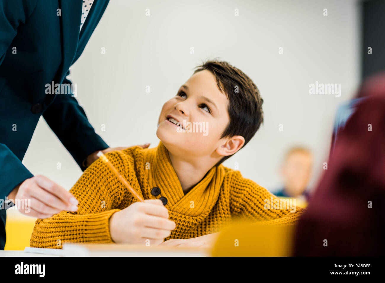 Boy holding pencil hi-res stock photography and images - Alamy