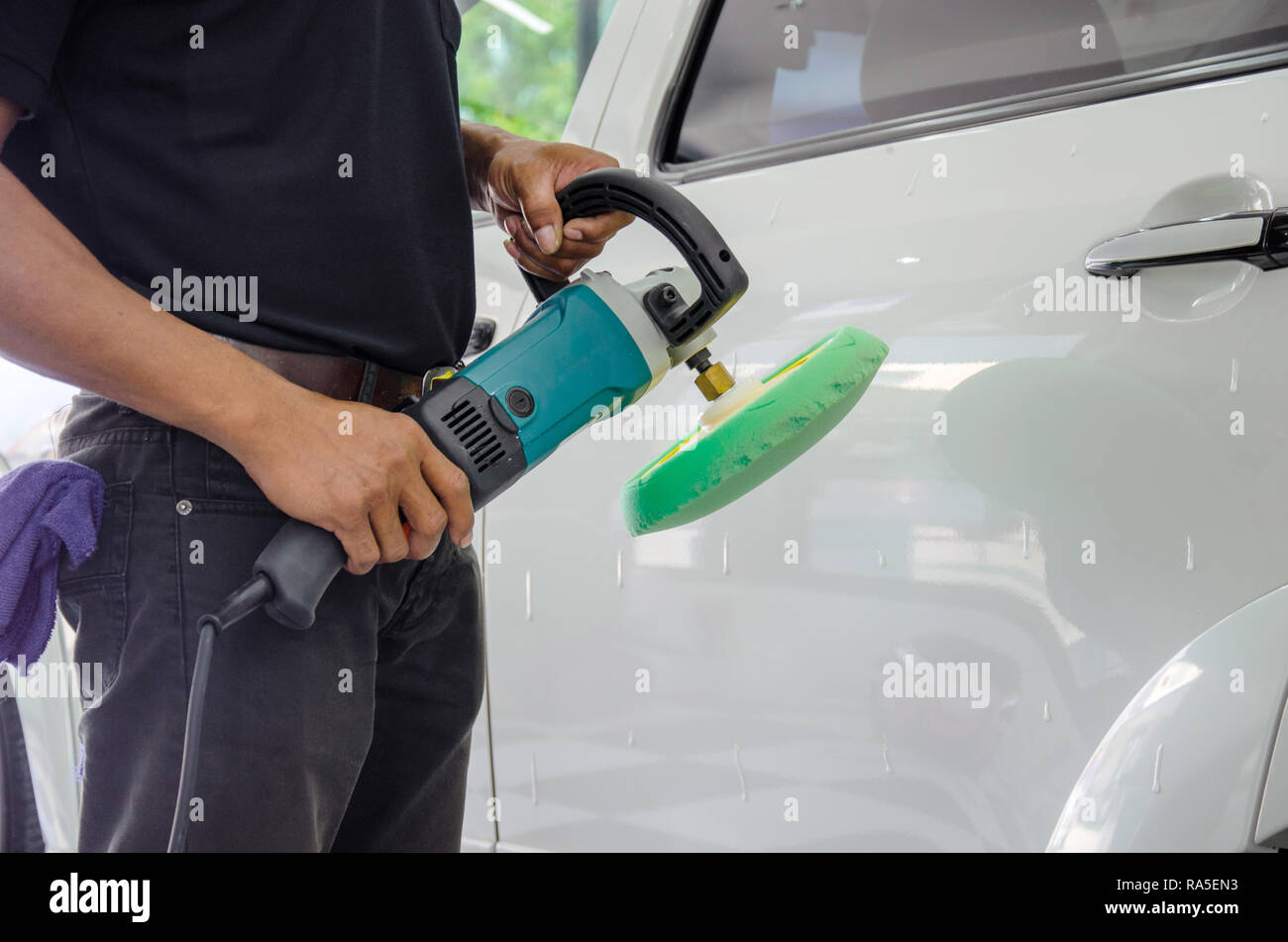 Man working for polishing, coating cars Stock Photo - Alamy