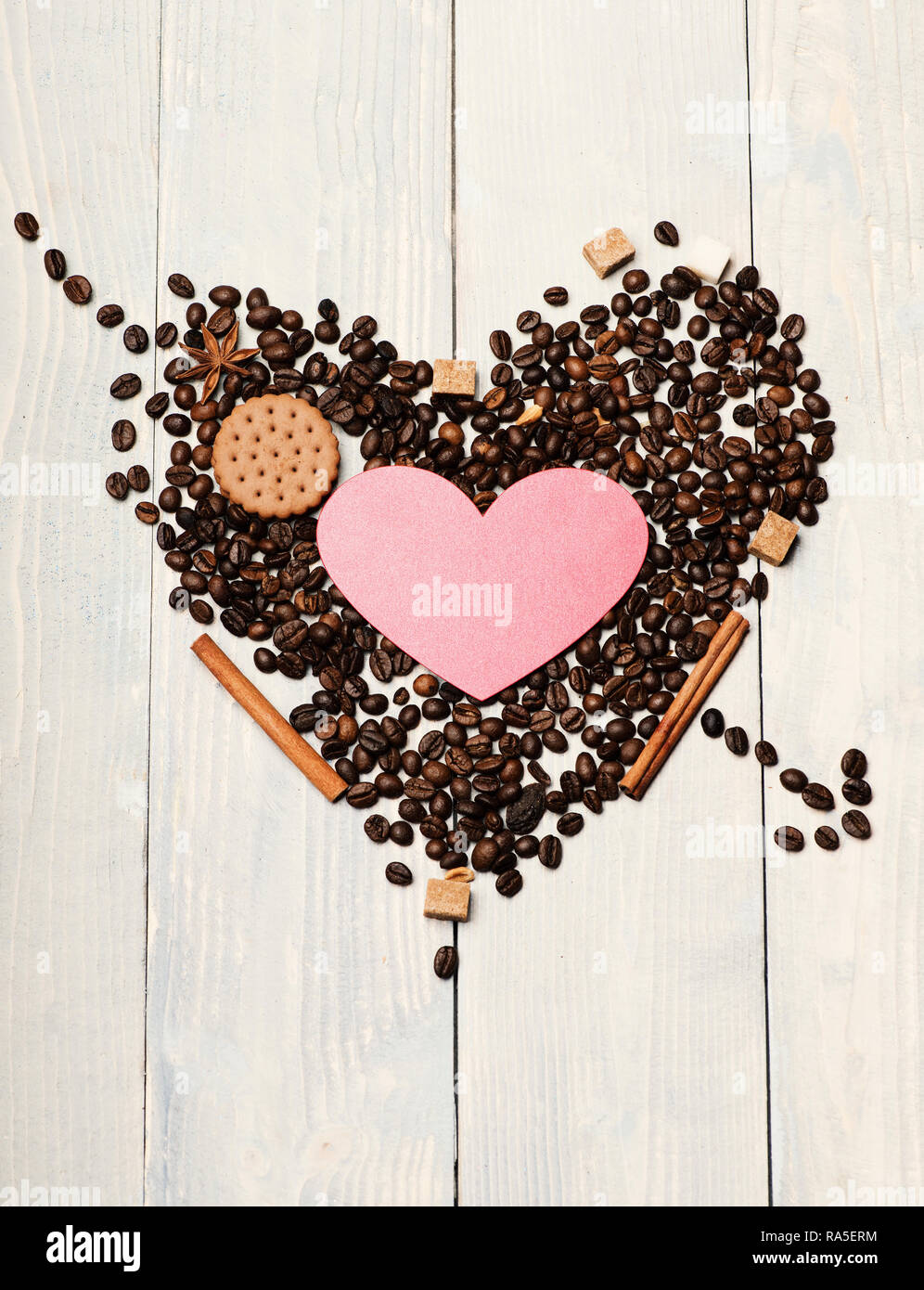 Heart made of food and spices on light wooden background. Pattern made ...