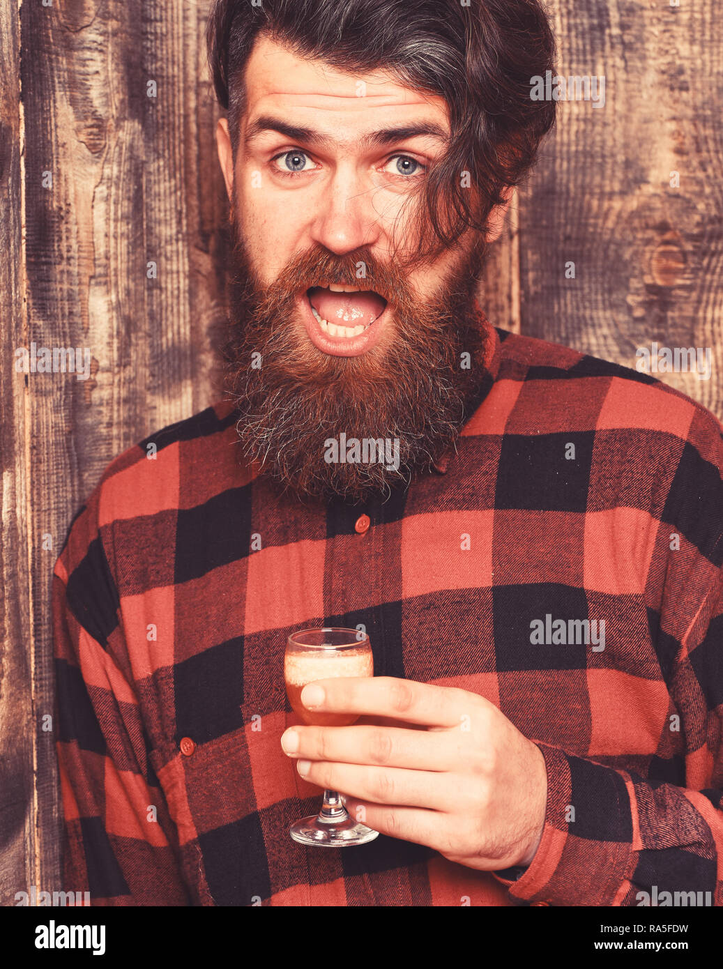 Hipster enjoy strong alcohol short or cocktail. Man holds alcohol ...