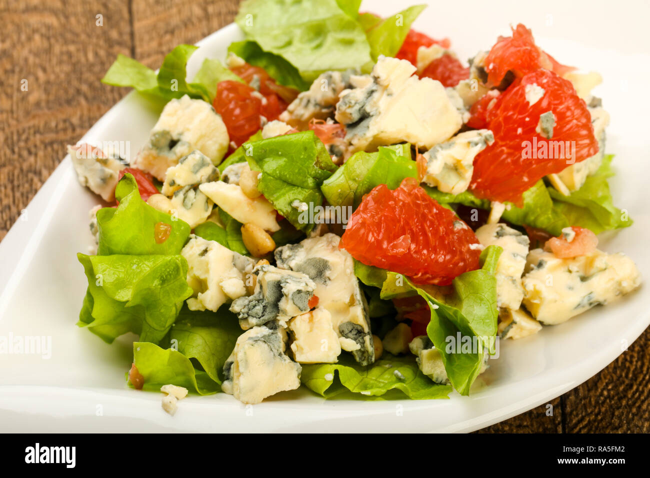Grapefruit and blue cheese salad with cedar nut Stock Photo - Alamy