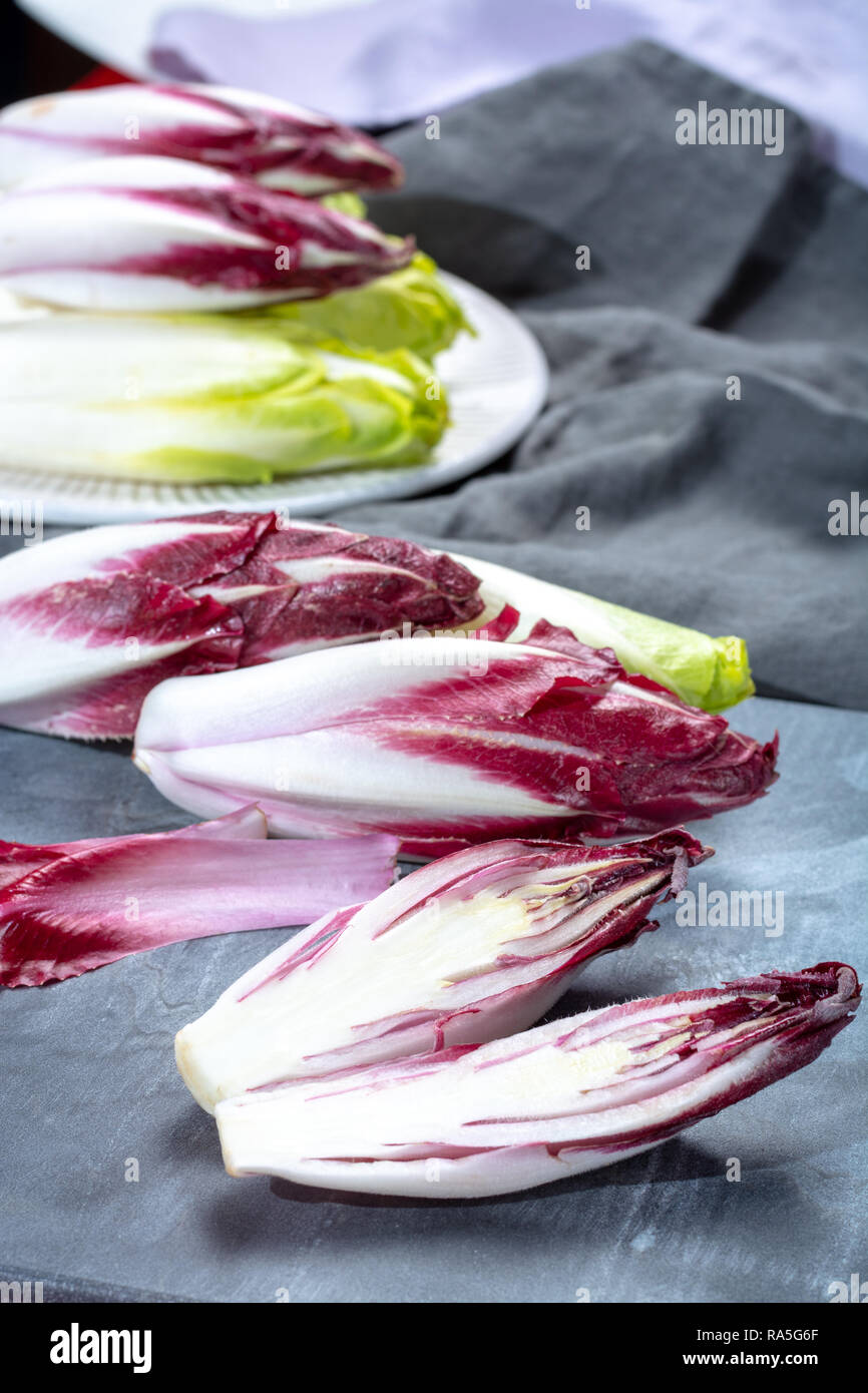Group of fresh green Belgian endive or chicory and red Radicchio ...