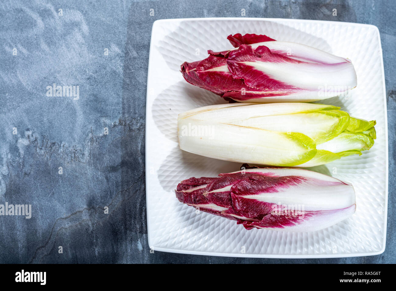 Food background, flat lay concept with fresh green Belgian endive or ...