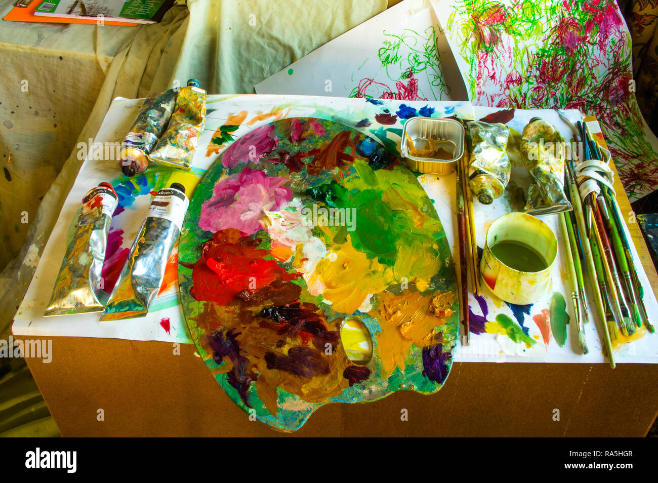 A small bench in an artist's studio with items needed for the painting ...