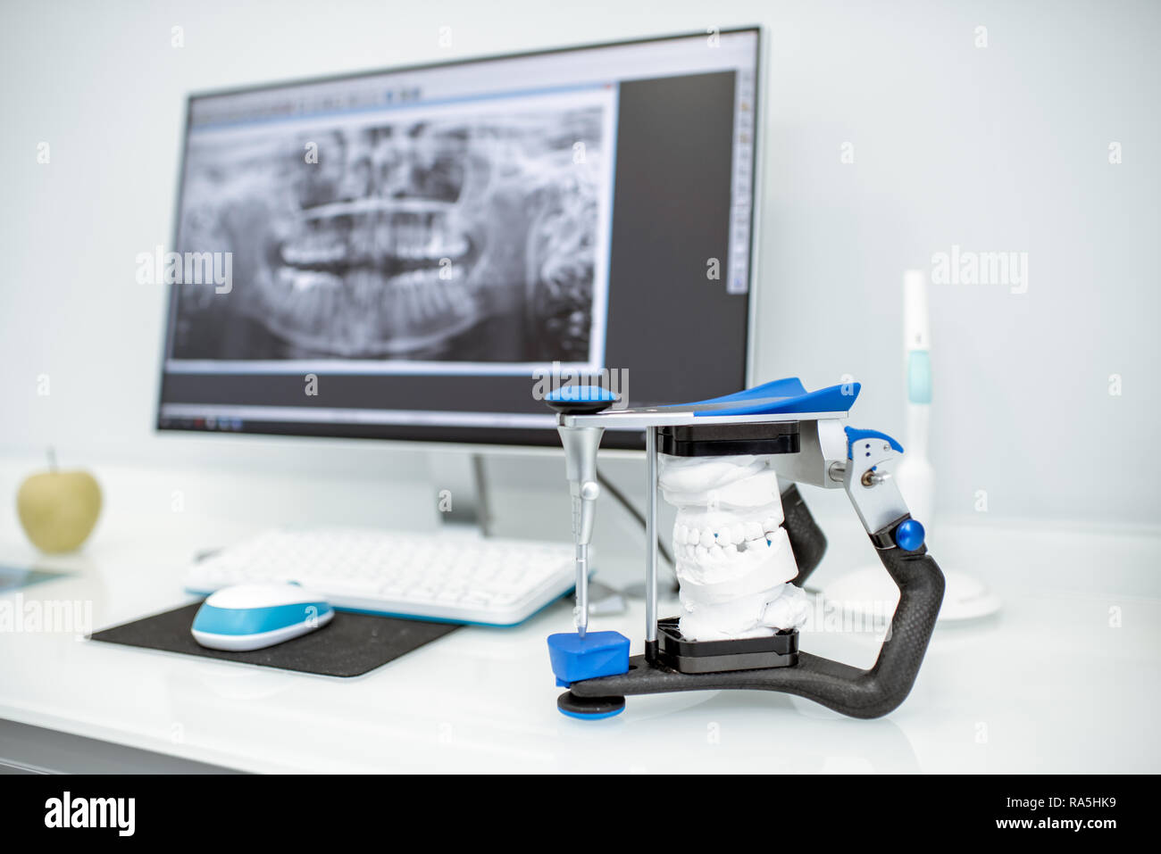 Working place with computer and artificial jaw in the dental office ...