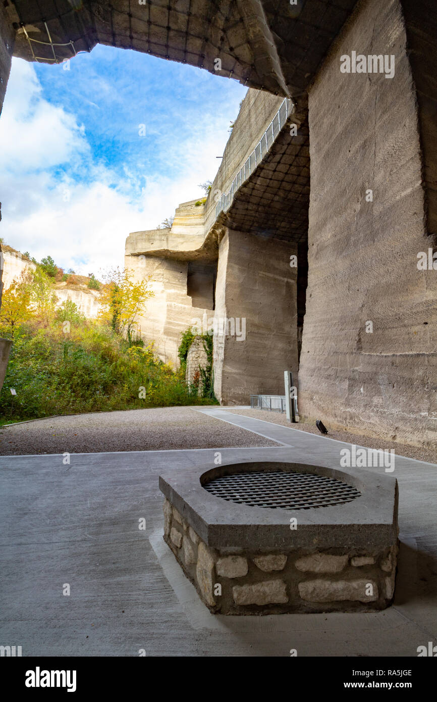 View of the limestone quarry cave in Fertorakos, Hungary. An old well ...