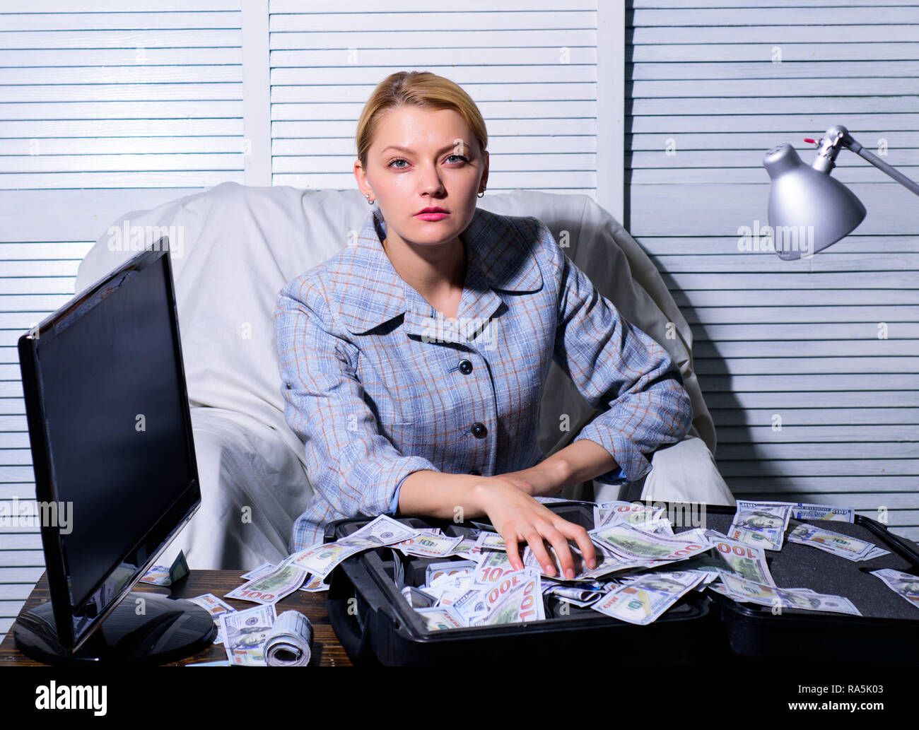 Financial success. Accountant with pile money hide under umbrella ...