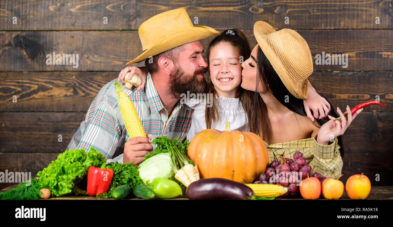 Parents and daughter harvest festival. Family farm concept. Family ...