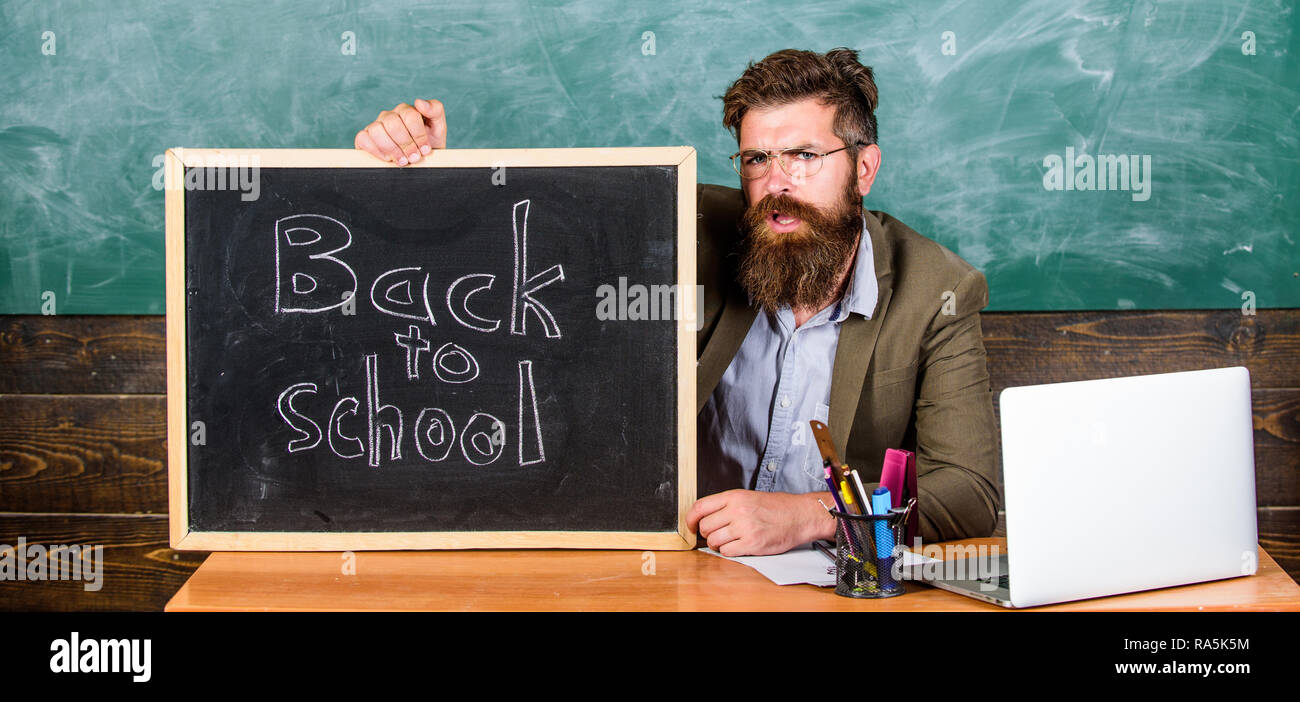 Welcome back. Teacher welcomes new pupils to enter educational ...