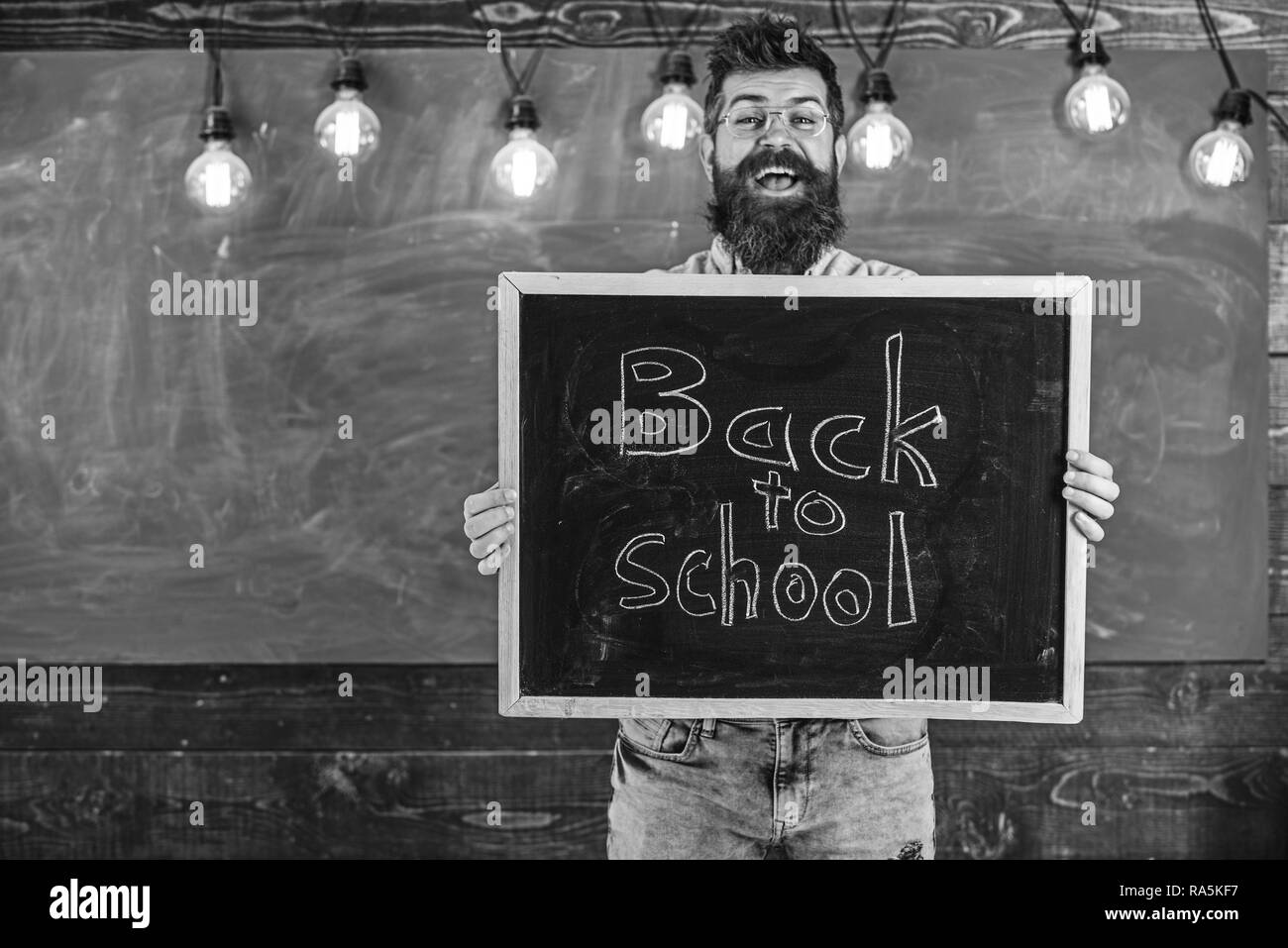 High school concept. Man with beard and mustache on cheerful smiling ...