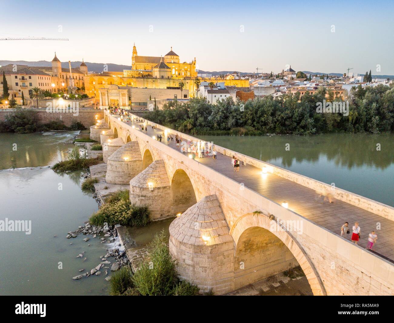 Aerial view of famous Roman bridge and Mosque, Cathedral of Cordoba ...