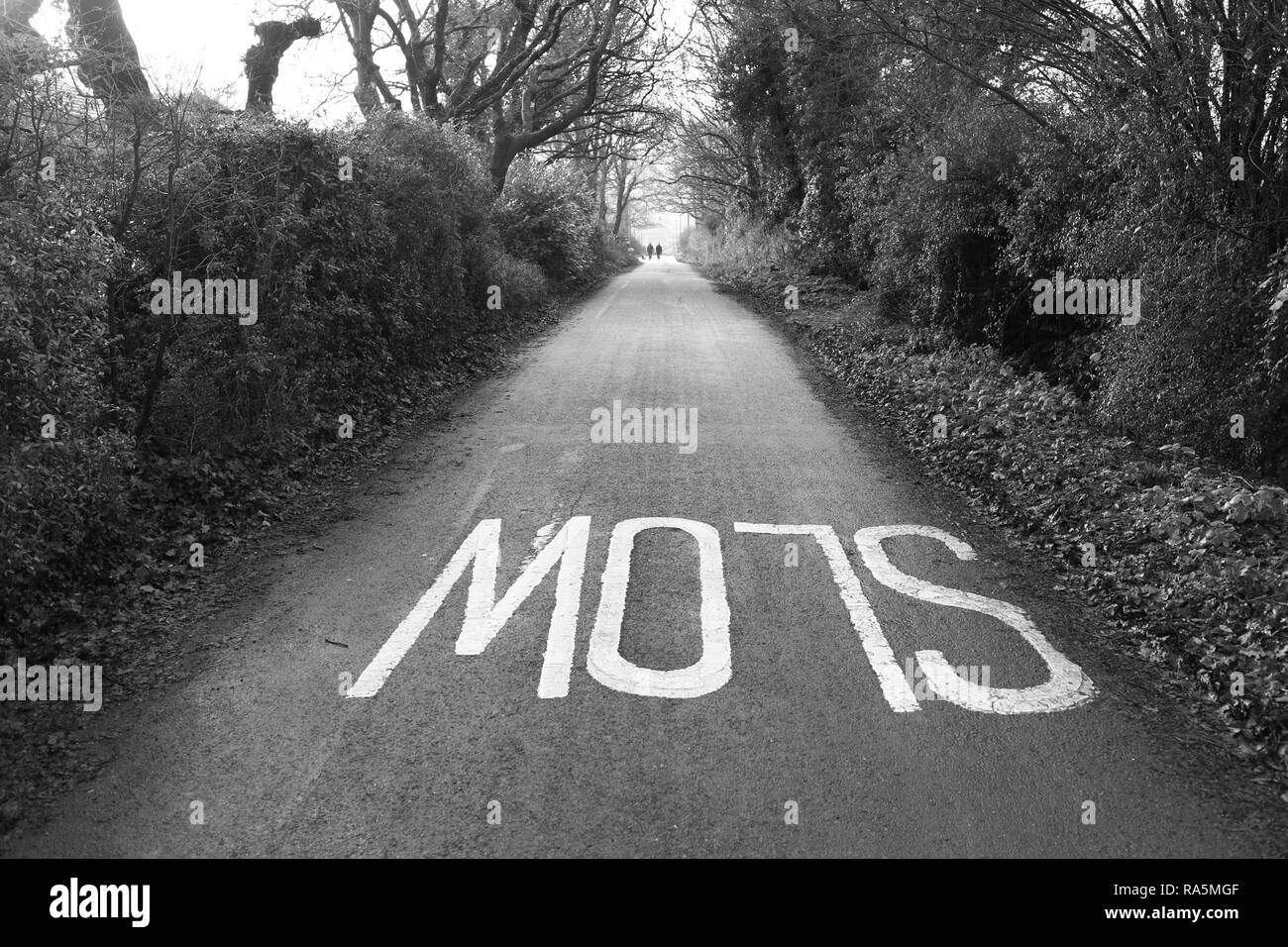 Slow sign on road Stock Photo - Alamy