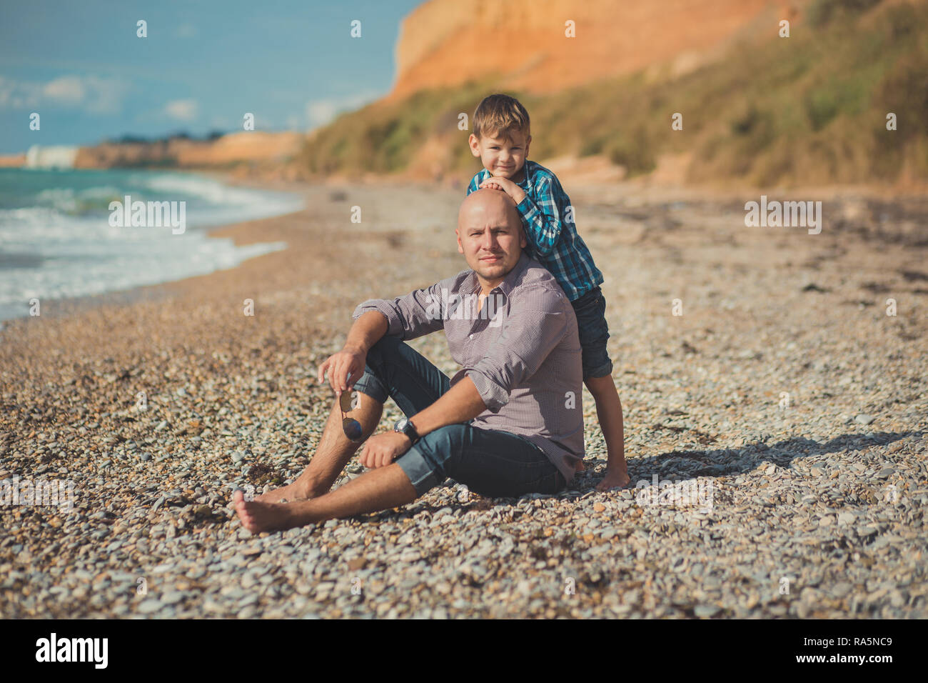 Touching appealing scene of father and son enjoy summer vacation ...
