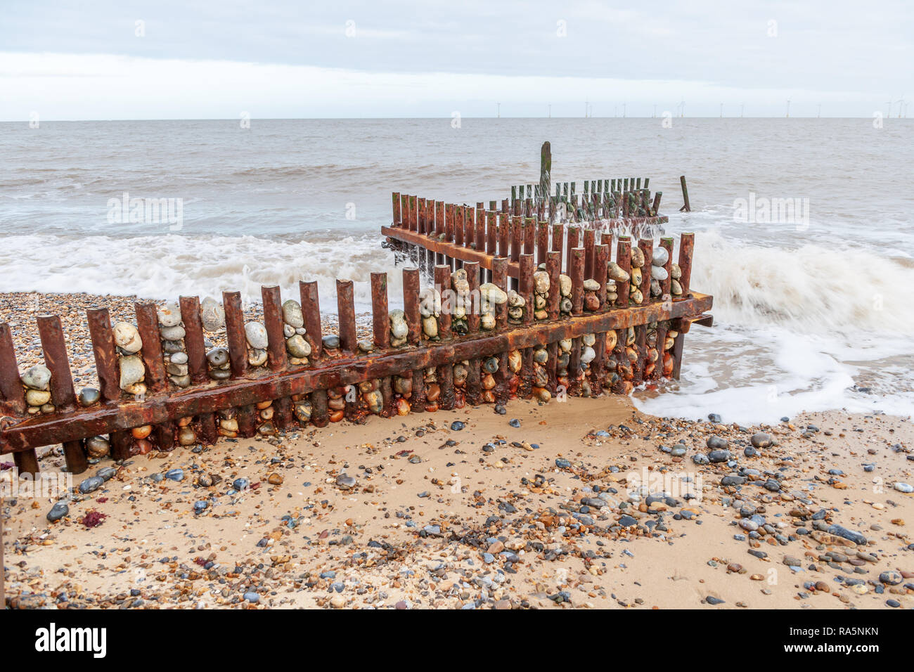 metal beach groynes sea defences on caister beach Stock Photo - Alamy