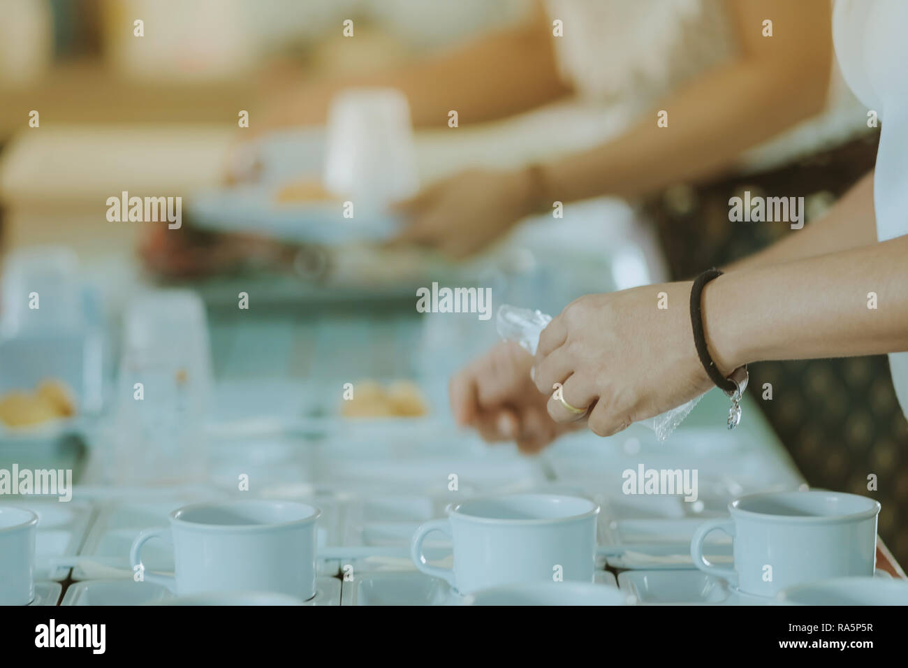 Woman prepare snack and beverage for conference lunch break Stock Photo ...