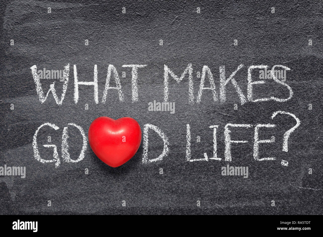 what makes good life question handwritten on chalkboard with red heart ...