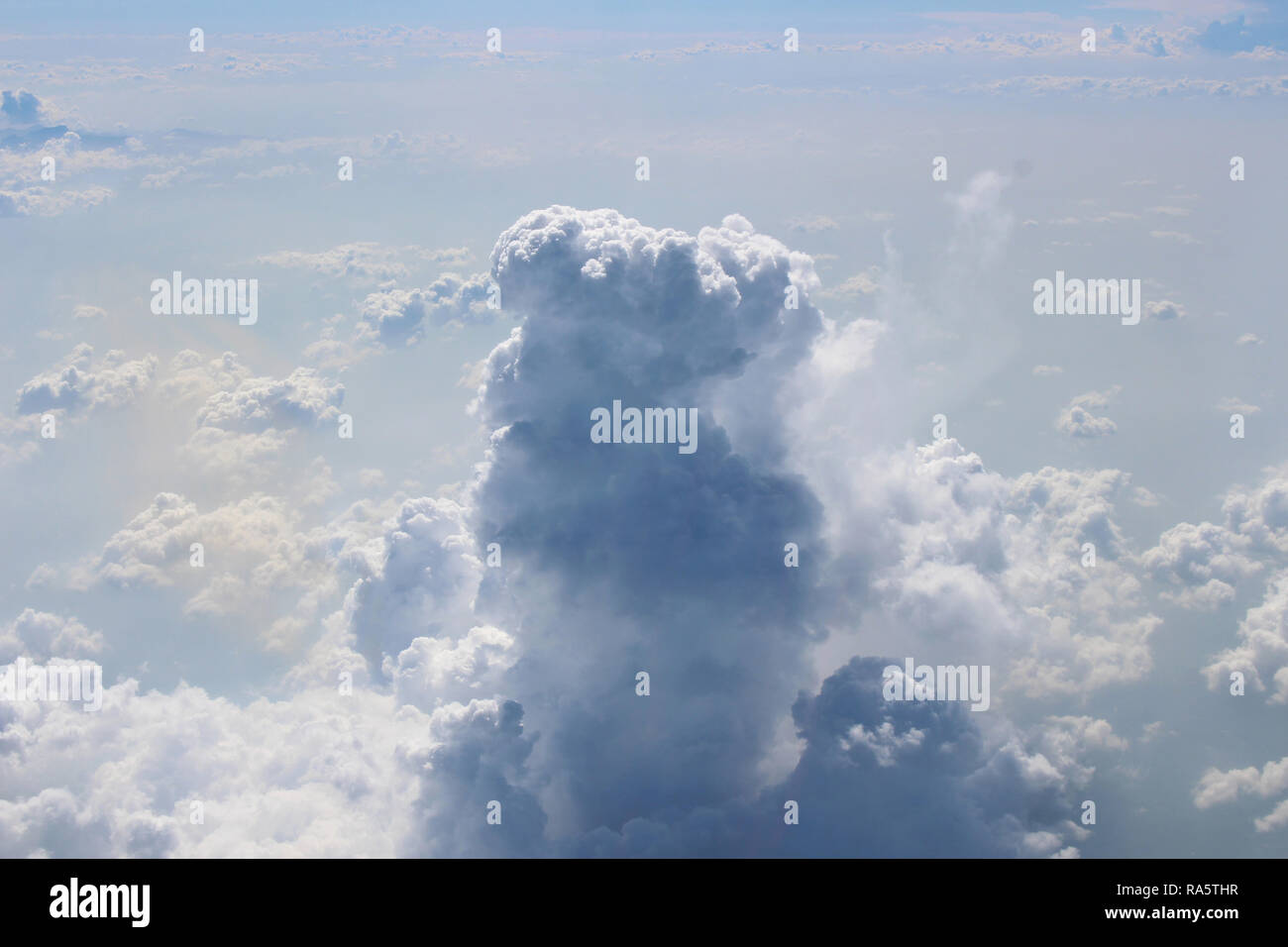 Aerial shot flying over and through cumulonimbus and cumulus clouds ...